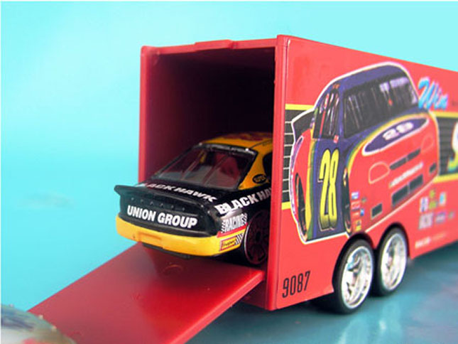 Racing Team with Trailer and 3 Race Cars - - Fat Brain Toys